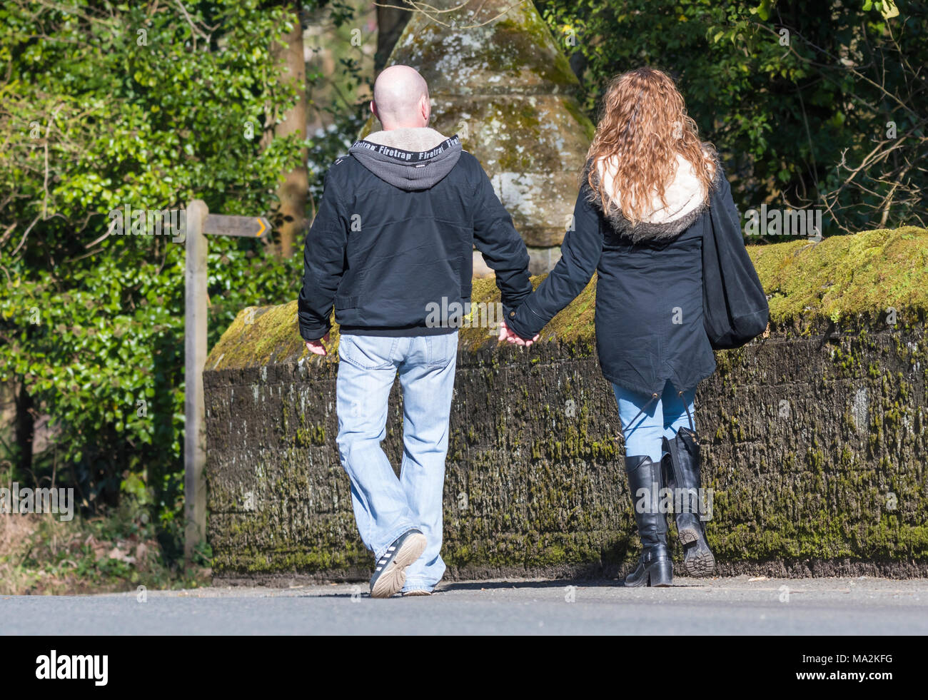 Lovers walking hand in hand hi-res stock photography and images - Alamy