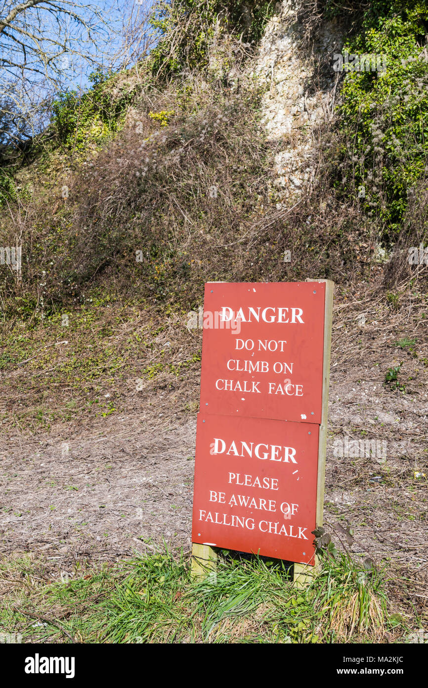 Danger, beware of falling chalk sign, by chalk rock face in the UK ...