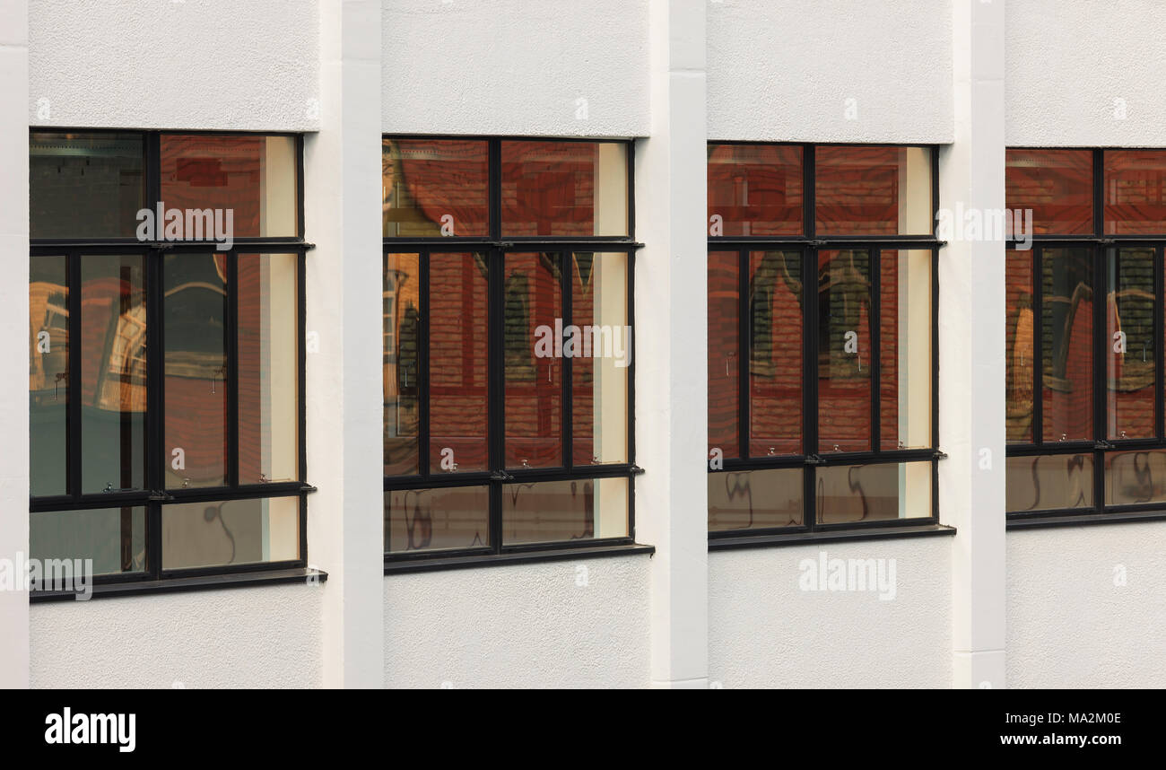 A view through the windows of an empty office block Stock Photo - Alamy