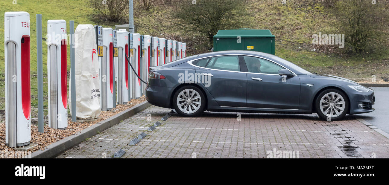 A Tesla Electric Car charging at a Warwick motorway service station ...