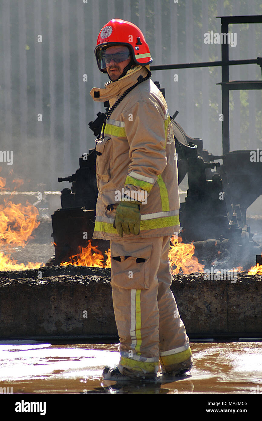 fire-fighter at incident, fire fighting Stock Photo - Alamy