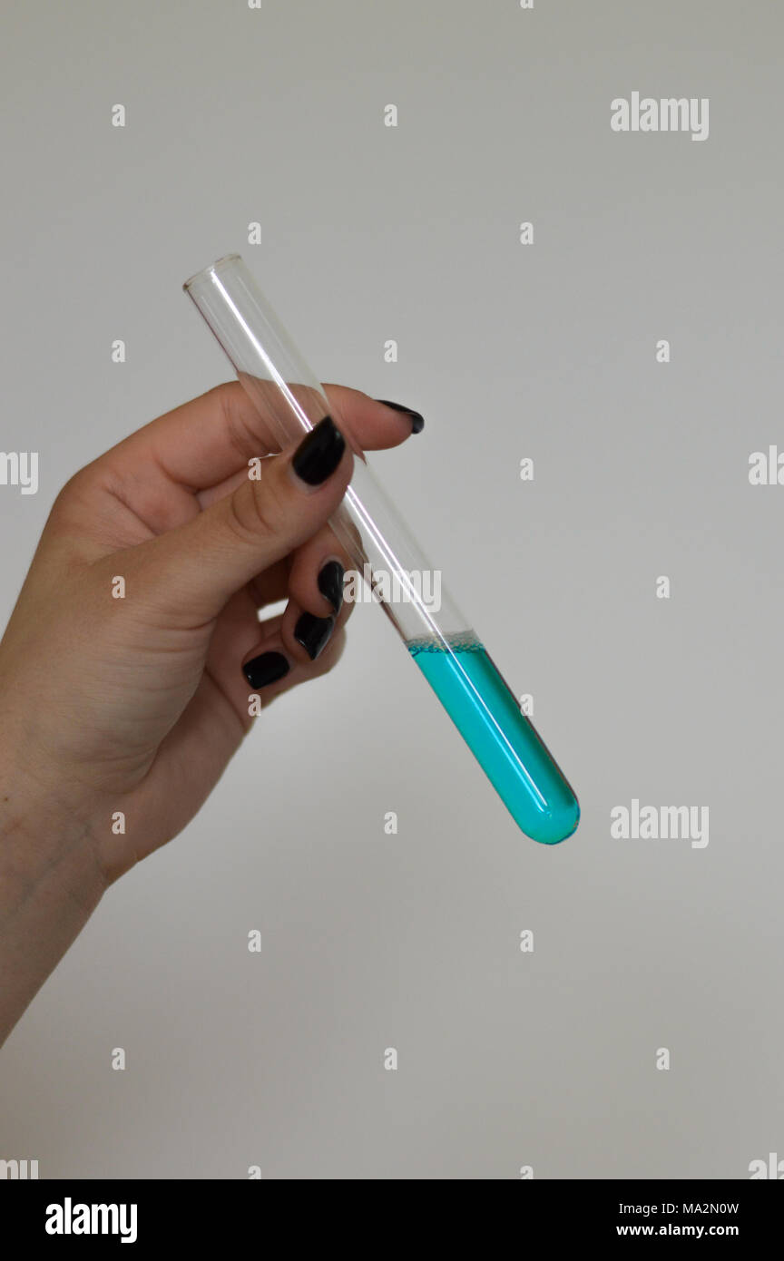 testing tube filled with blue chemical Stock Photo - Alamy