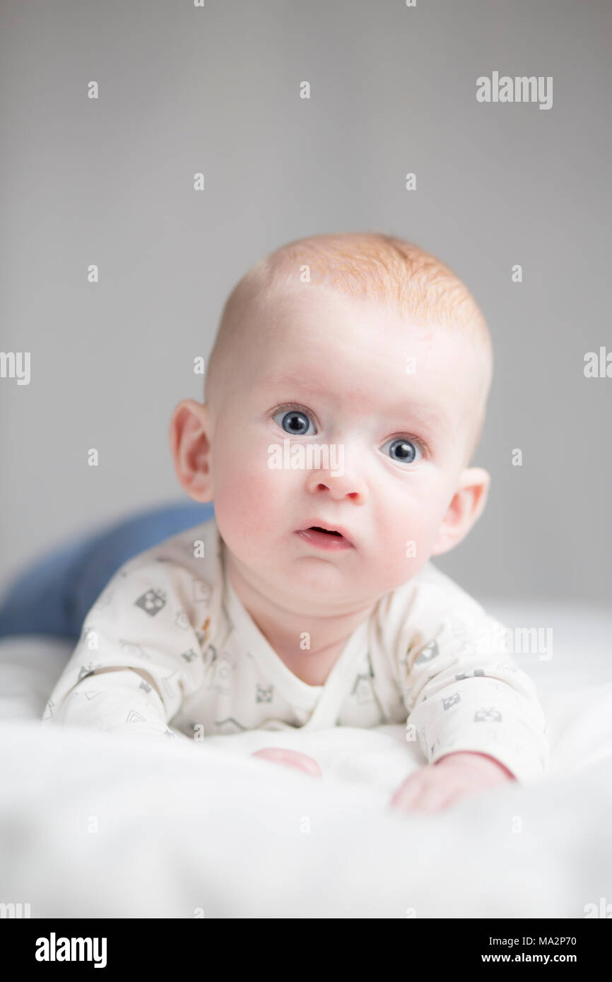 cute baby boy with a surprised expression Stock Photo - Alamy