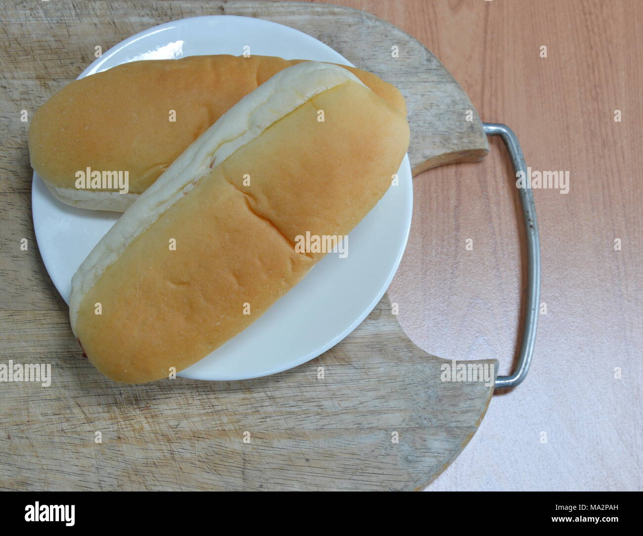 bread on wooden chop block Stock Photo - Alamy