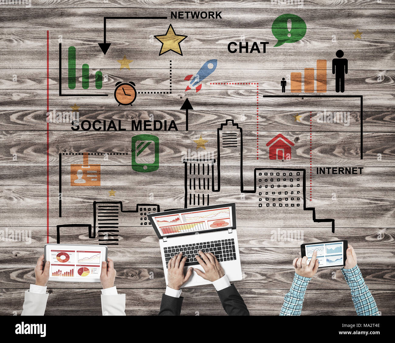 Group of three people with devices in hands working together as symbol ...