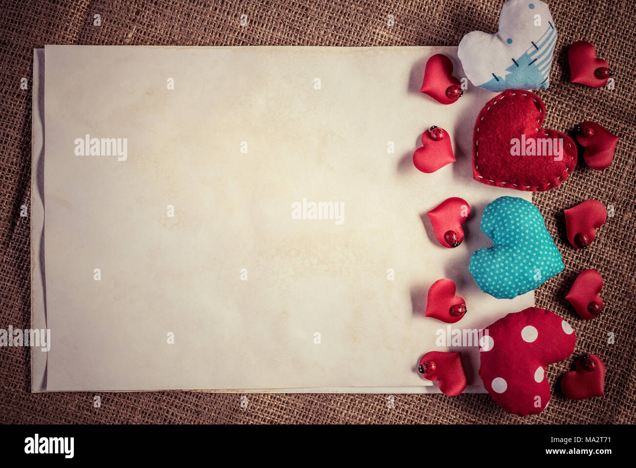 Handmade love hearts and sheets of blank paper Stock Photo - Alamy