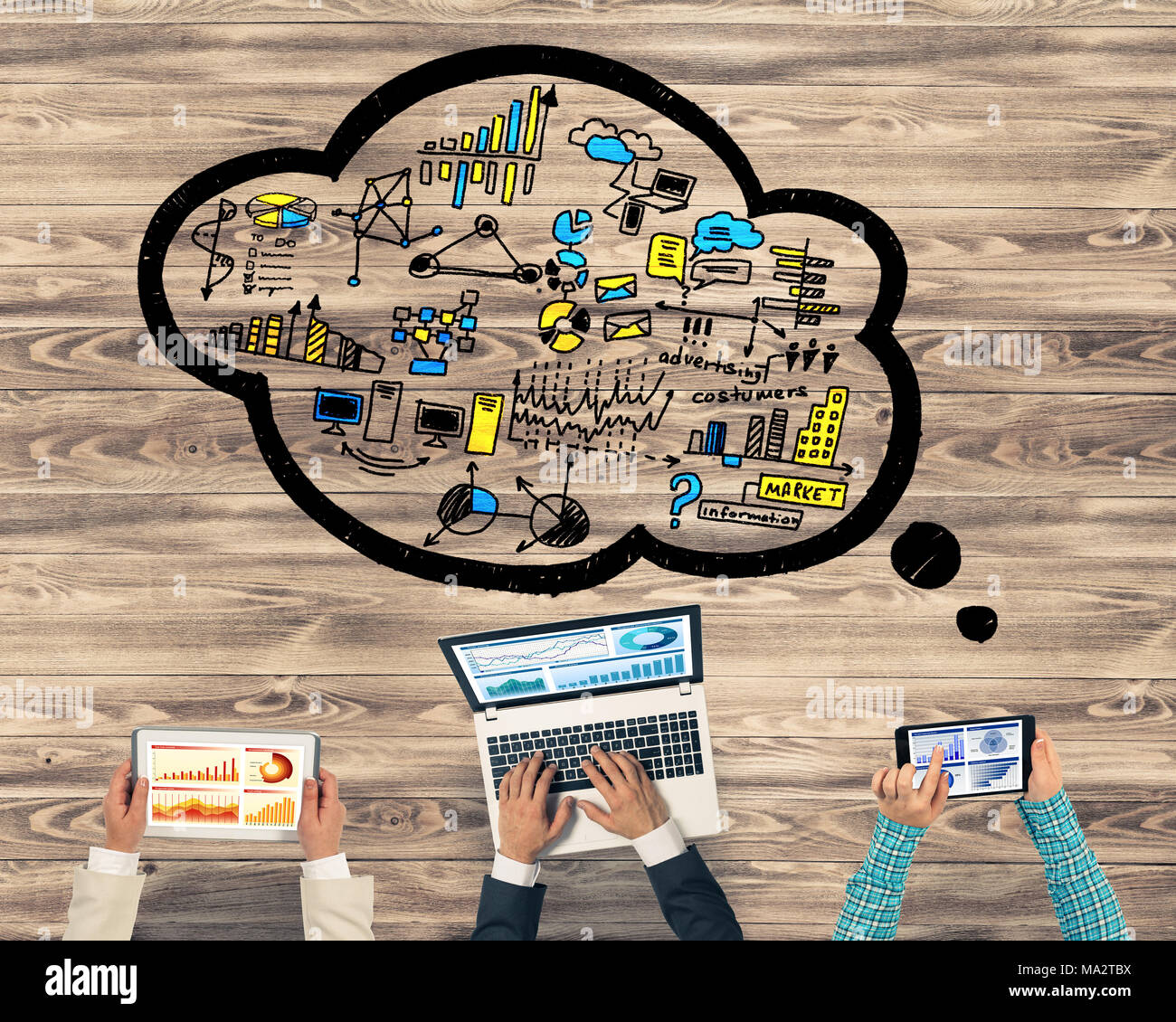 Group of people with devices in hands working together as symbol of ...