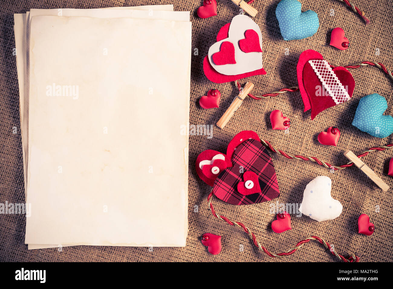 Handmade love hearts and sheets of blank paper Stock Photo - Alamy