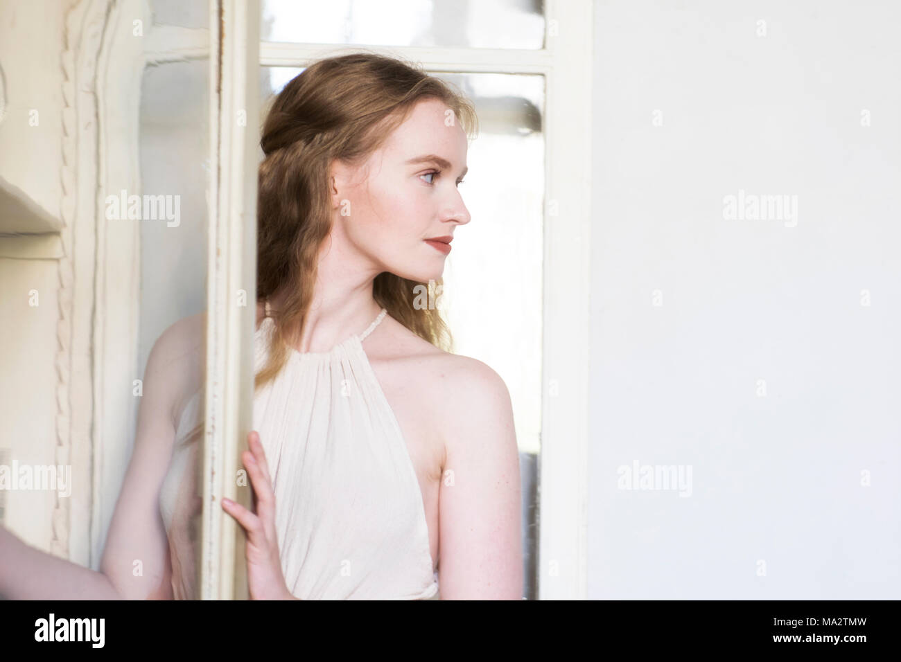 Young woman gray background blonde hi-res stock photography and images ...