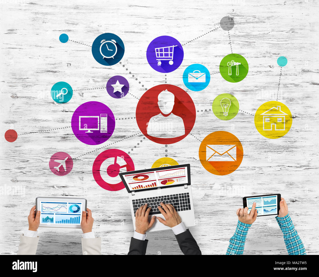 Group of three people with devices in hands working together as symbol ...
