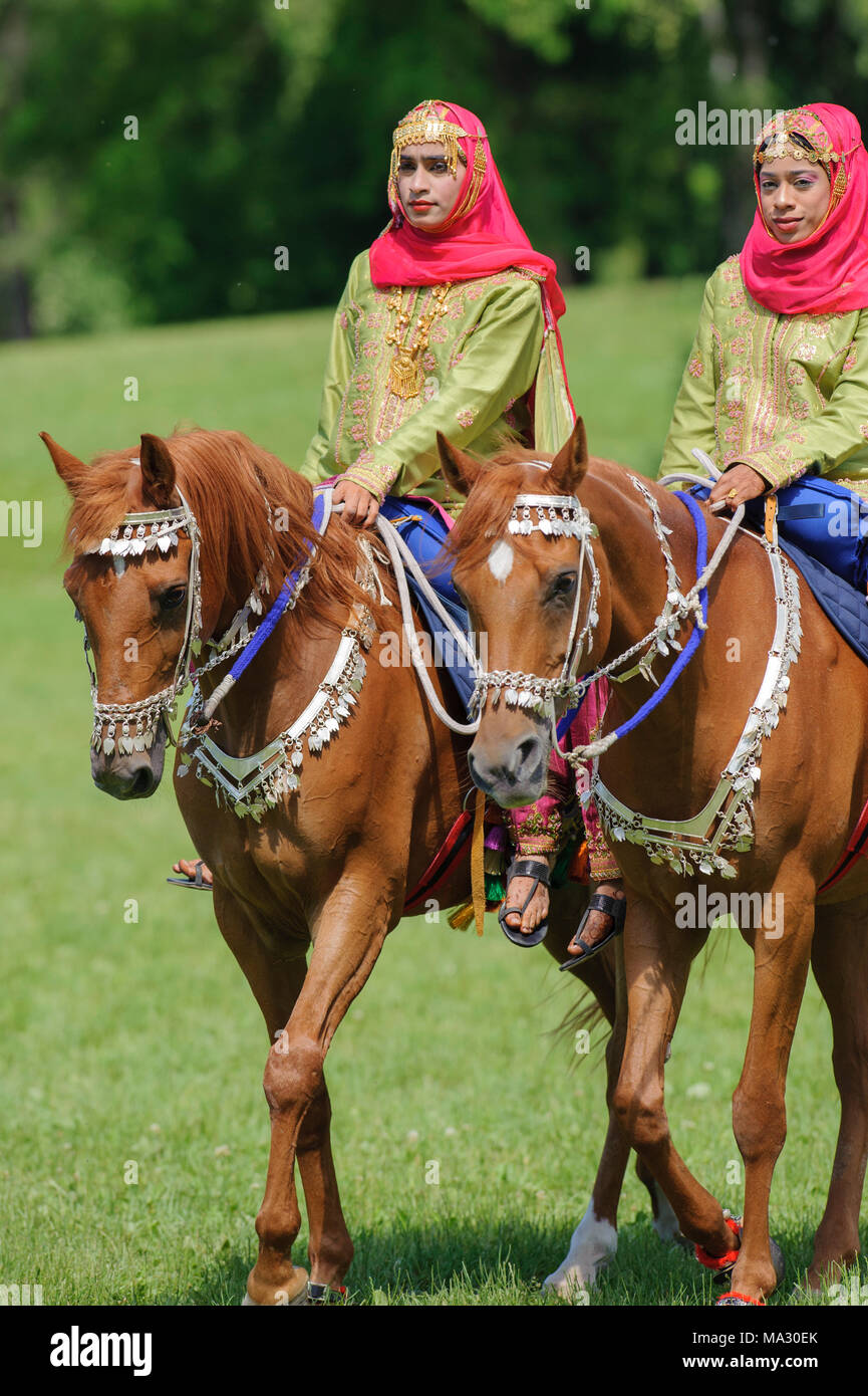 Members of the Arab show group "Royal Cavalry of Oman" ride in ...