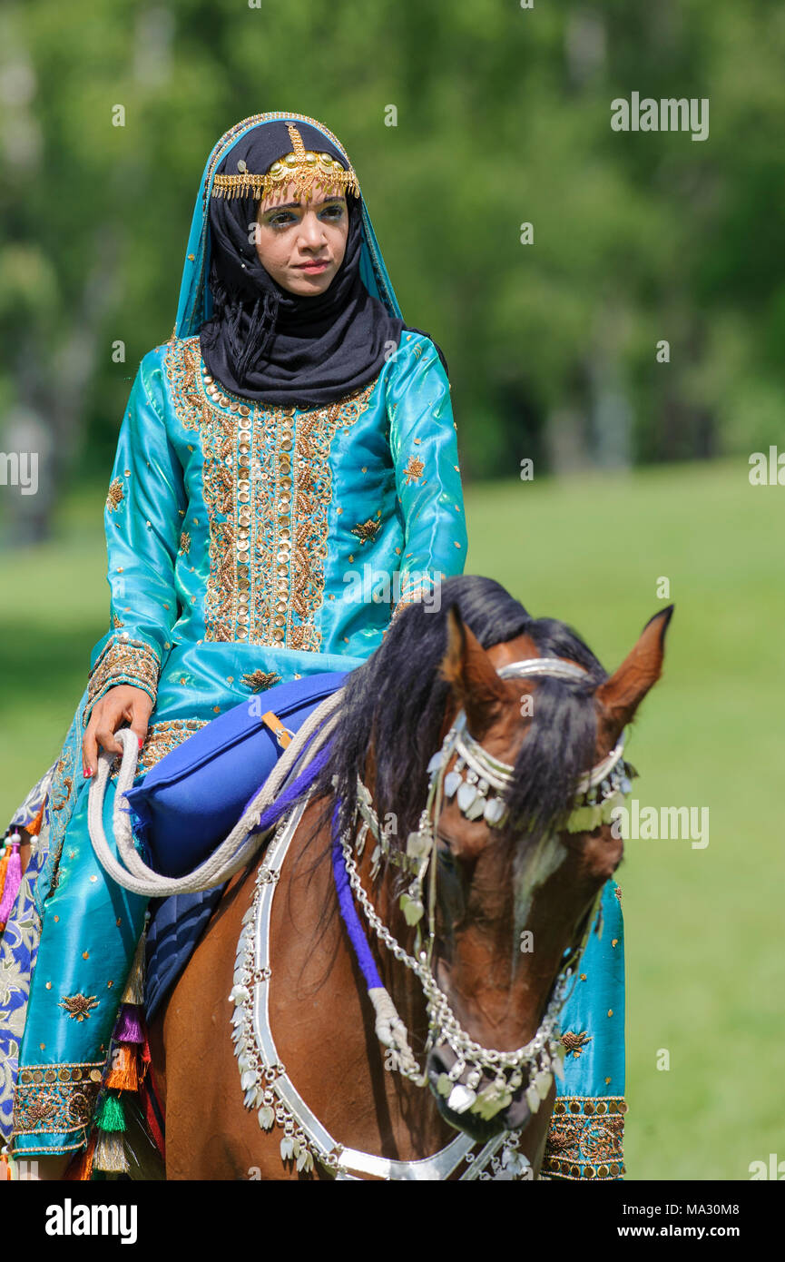 Members of the Arab show group "Royal Cavalry of Oman" ride in ...