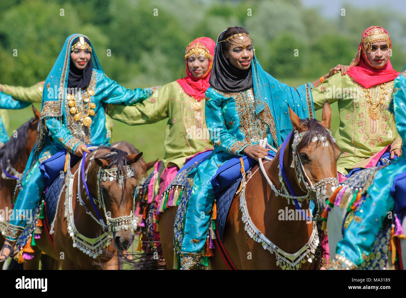 Members of the Arab show group "Royal Cavalry of Oman" ride in ...