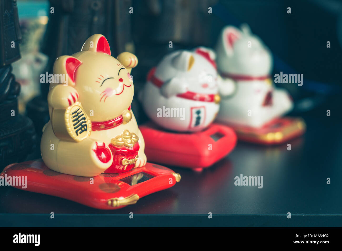 Maneki Neko Japanese lucky cat figures Stock Photo - Alamy