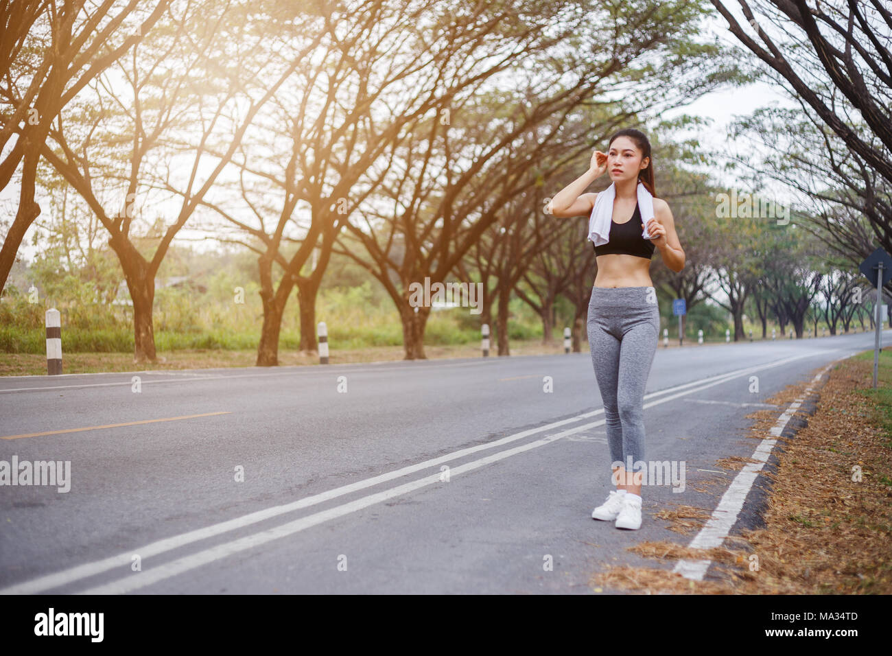 tired sporty woman after workout sport exercises outdoors at the park ...