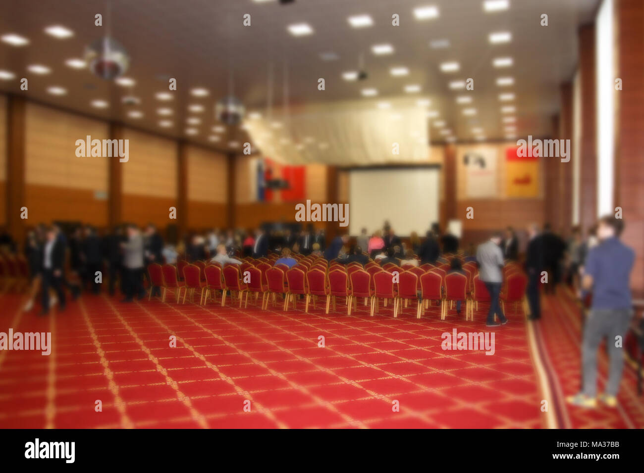 In a huge hall a large number of people are trained, a seminar on new ...