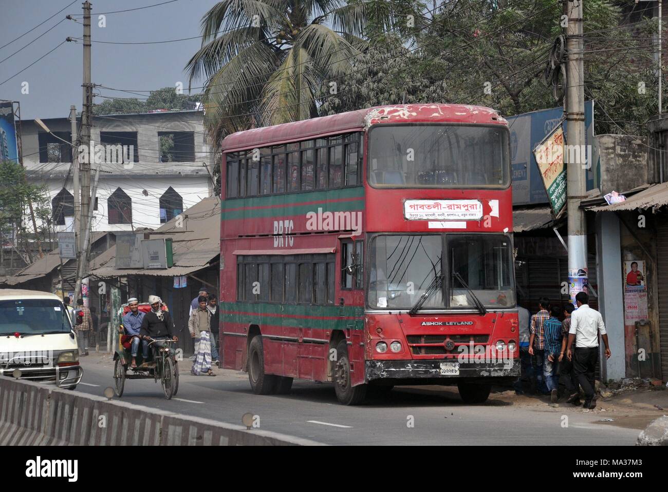 Double-decker bus and rickshaw at the station Tongi near Dhaka on 09.01 ...