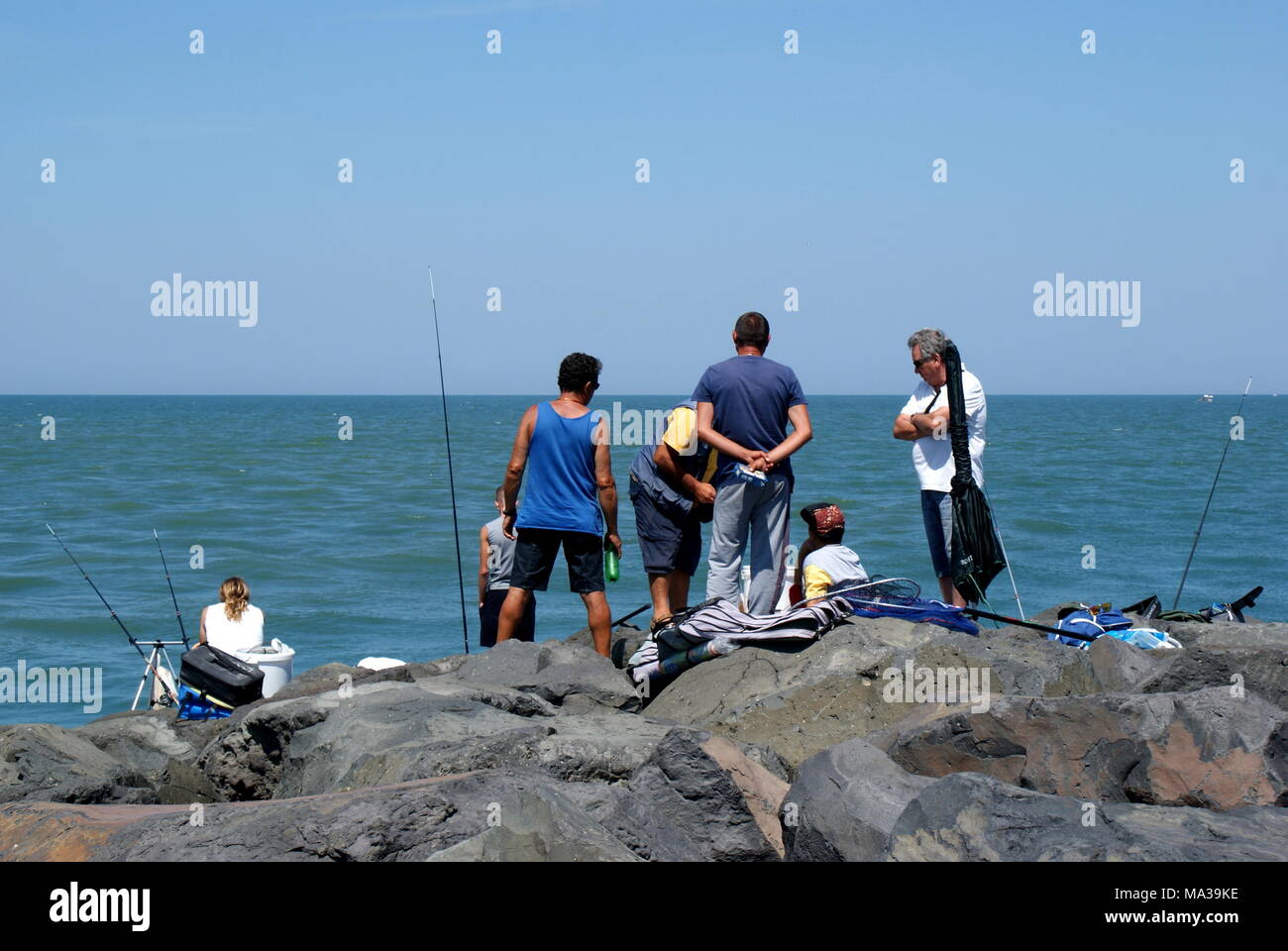 Fishermen fishing from rocks hi-res stock photography and images - Alamy