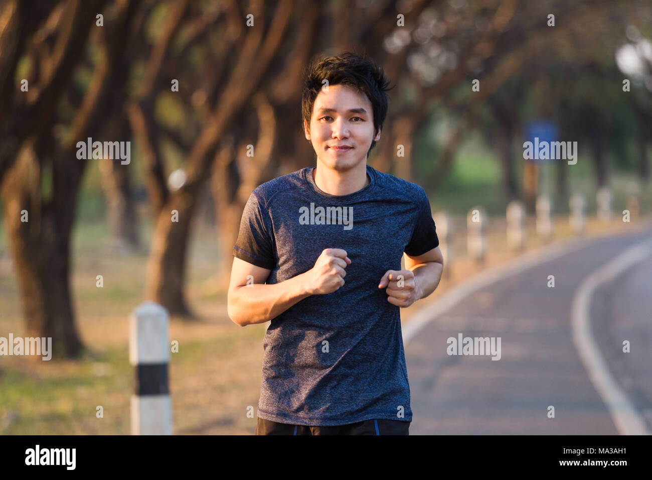 fitness man running in the park Stock Photo - Alamy