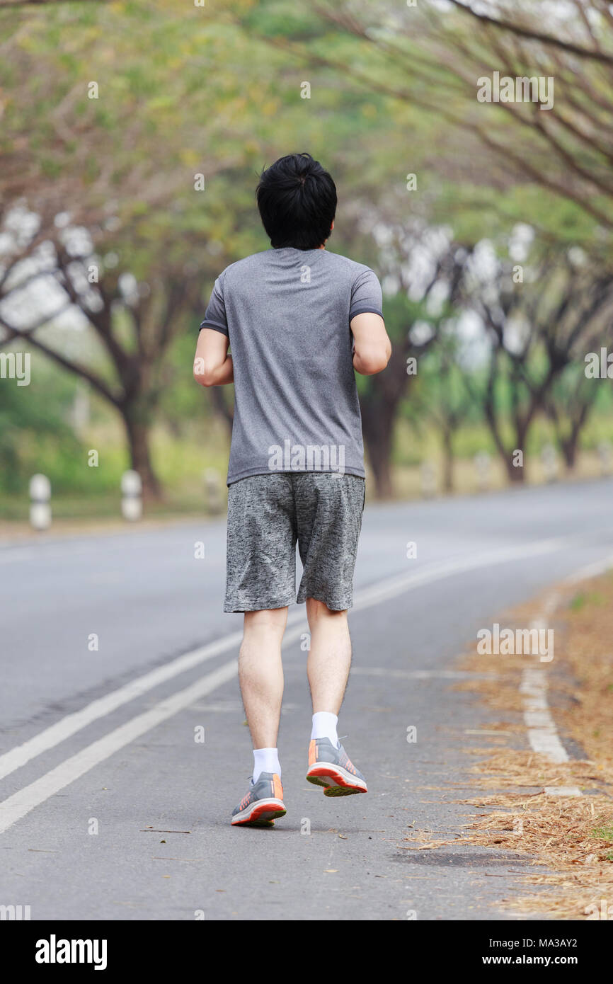 Man full rear view running motion hi-res stock photography and images ...