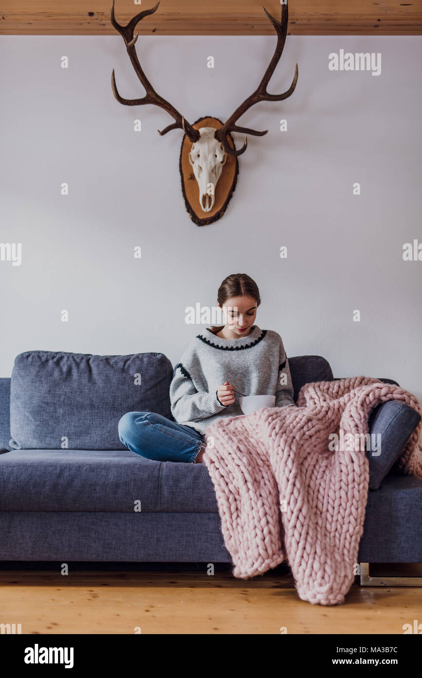 Woman on a sofa hi-res stock photography and images - Alamy