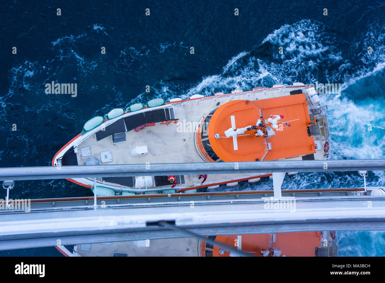 Pilot boat alongside cruise ship Stock Photo - Alamy