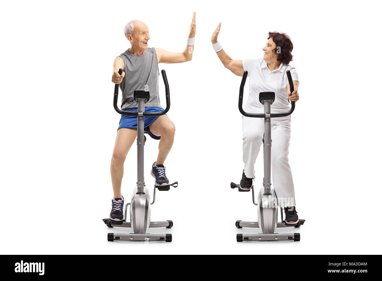 Seniors on exercise bikes high-fiving each other isolated on white ...
