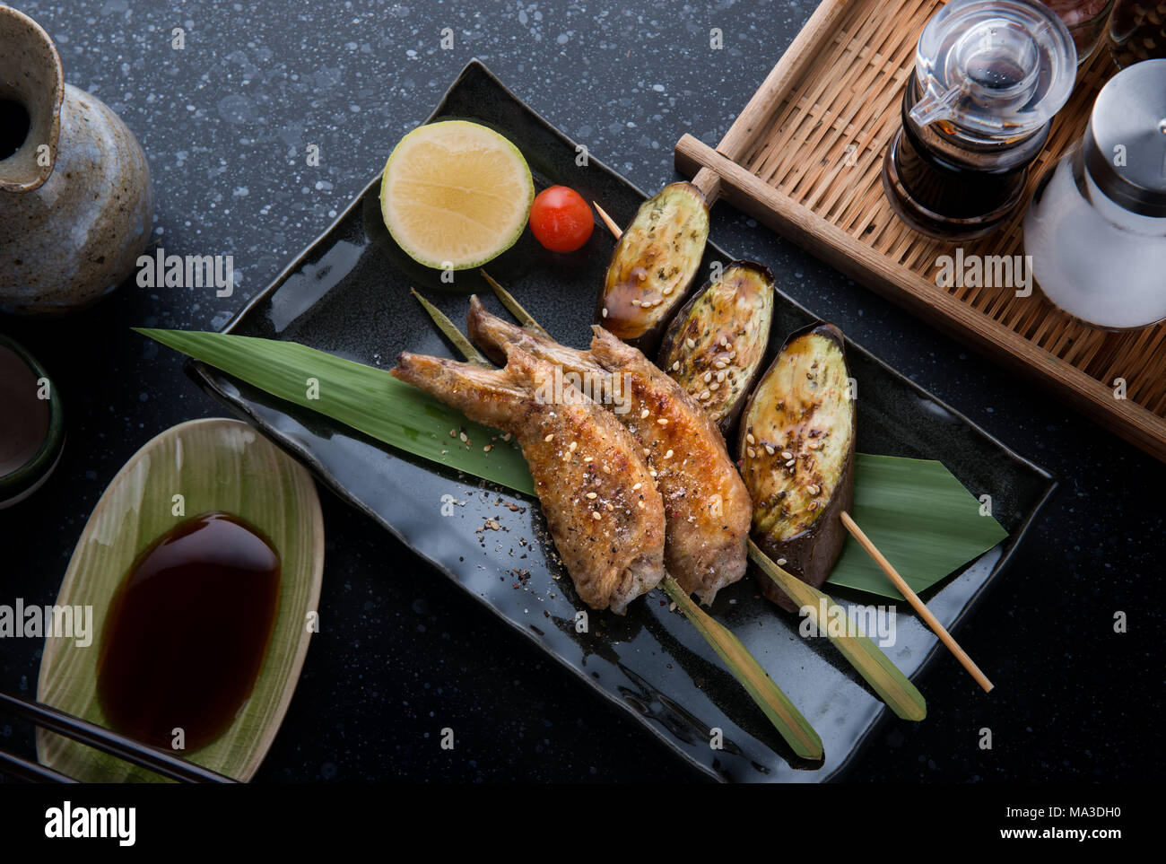 Grill chicken wing with salt seasoning in Japanese skewer grill food ...