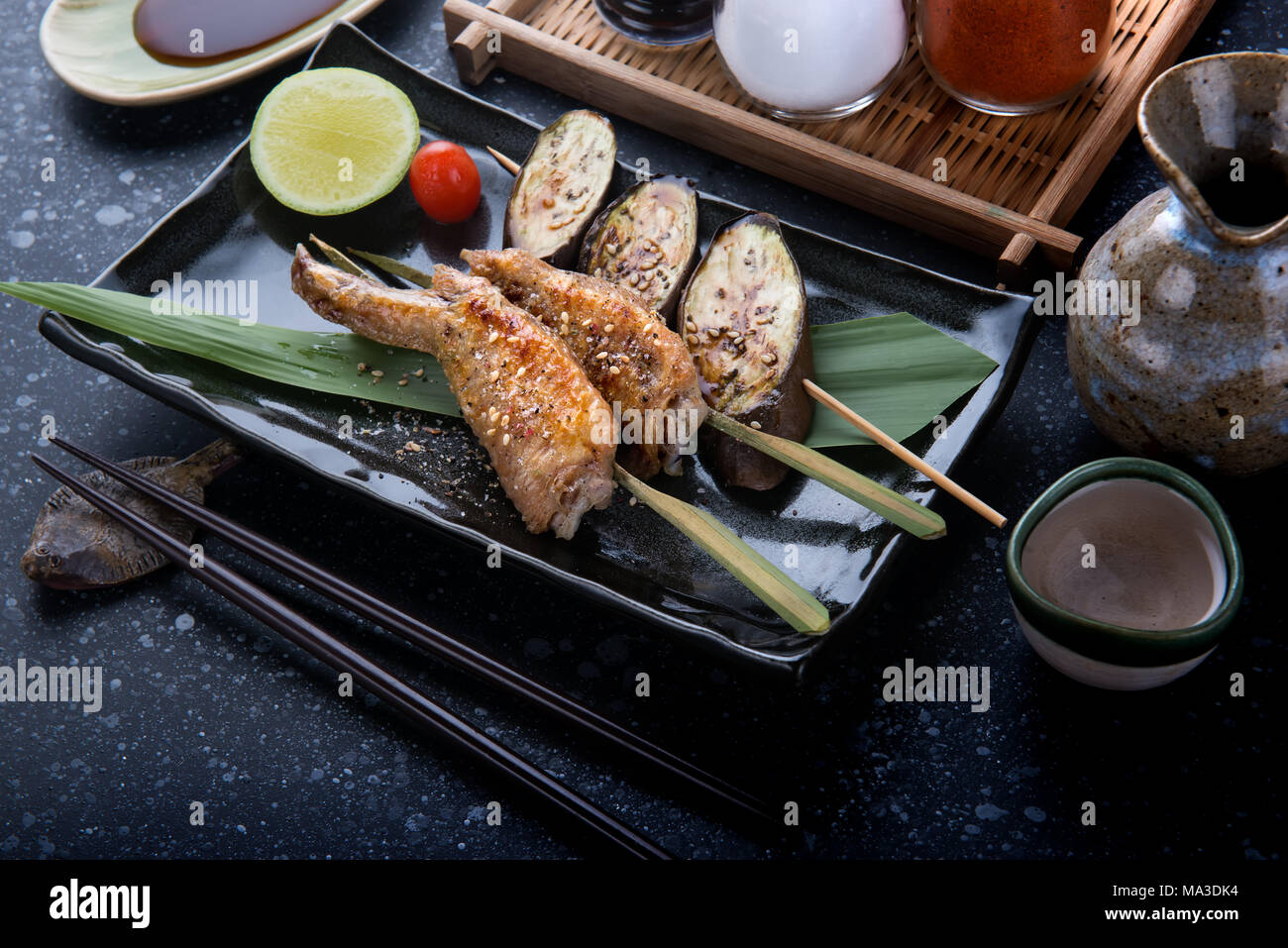 Grill chicken wing with salt seasoning in Japanese skewer grill food ...
