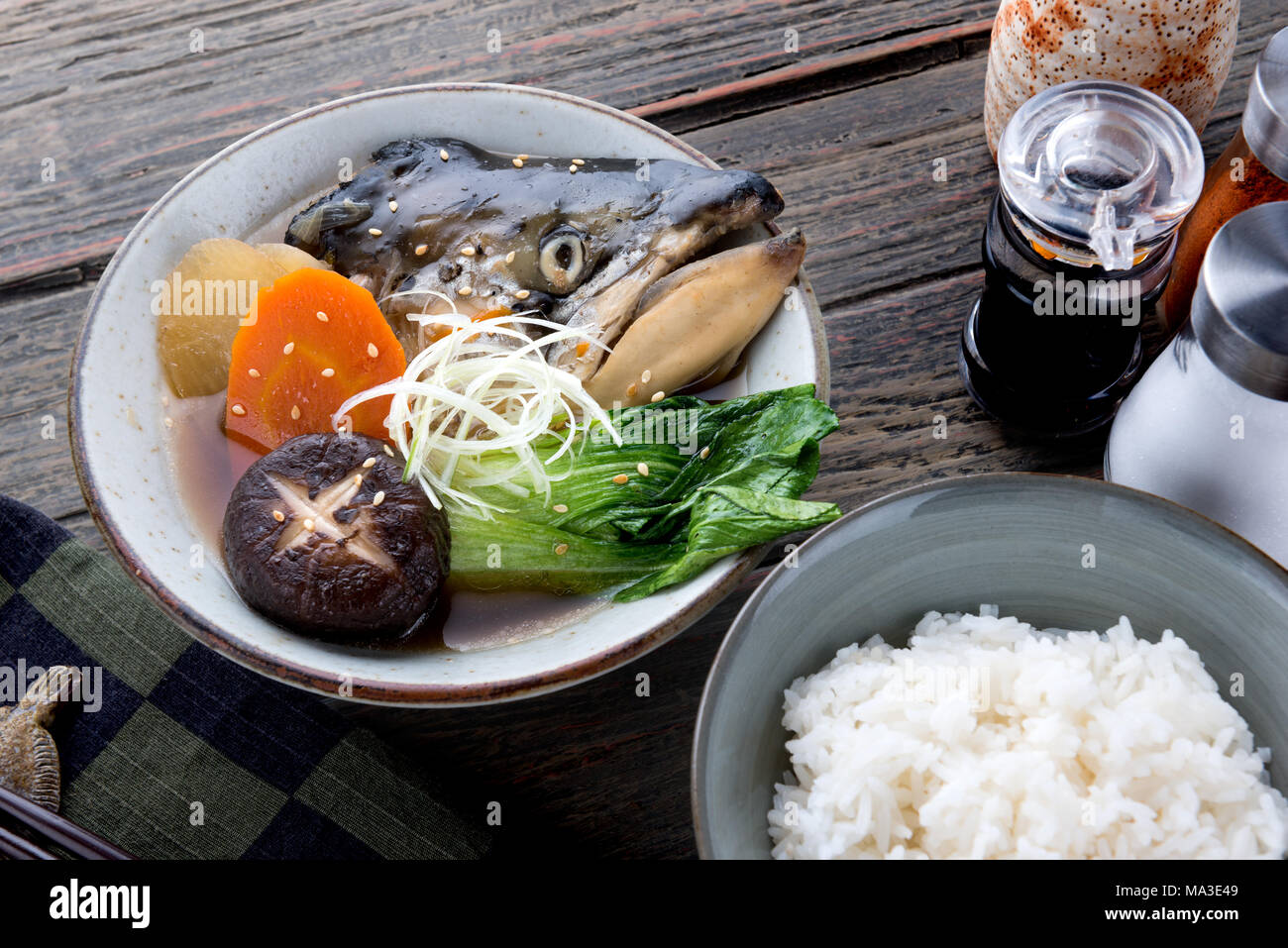 Salmon head in soya soup steamed with ingredient in Japanese style food ...