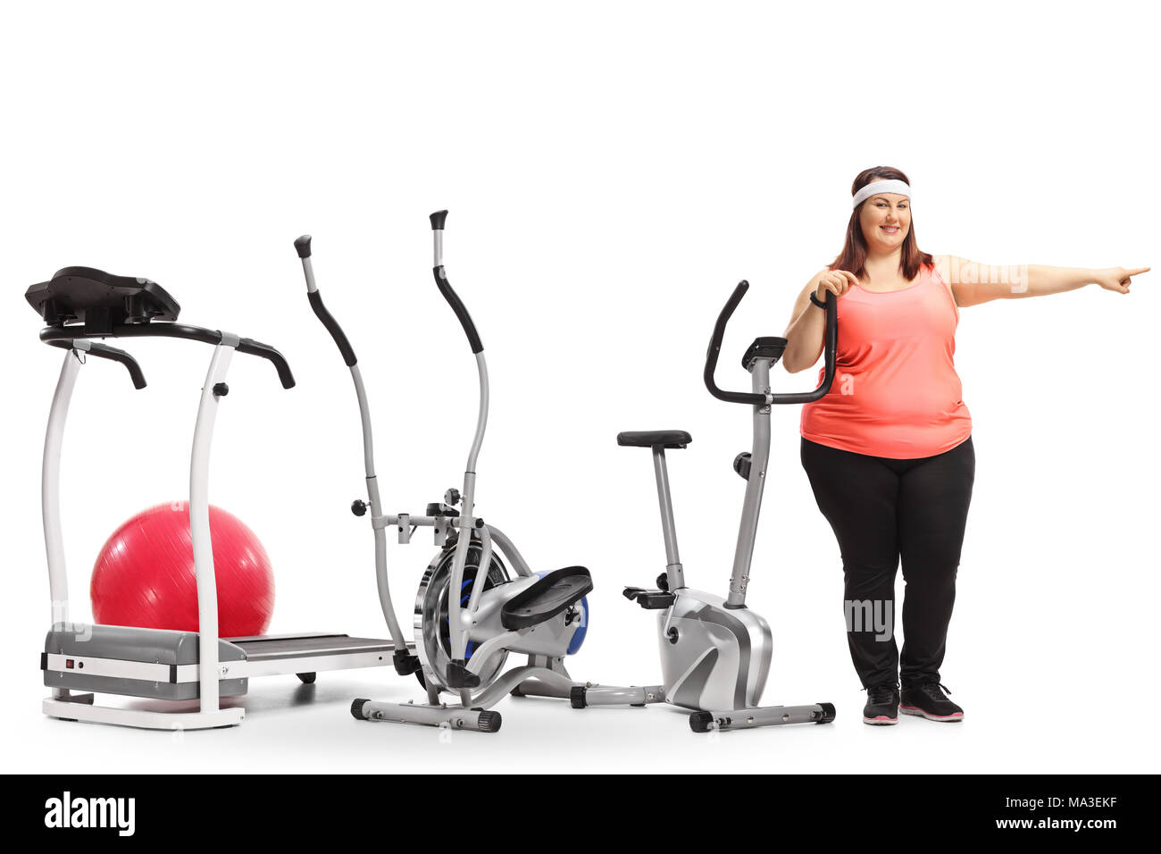 Full length portrait of an overweight woman standing by exercise ...