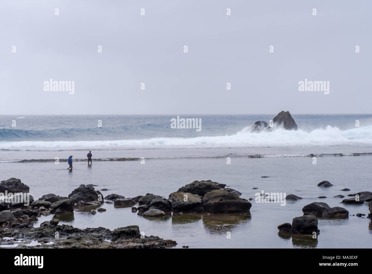 Local fishermen fishing at shore of Batanes, Philippines Stock Photo ...