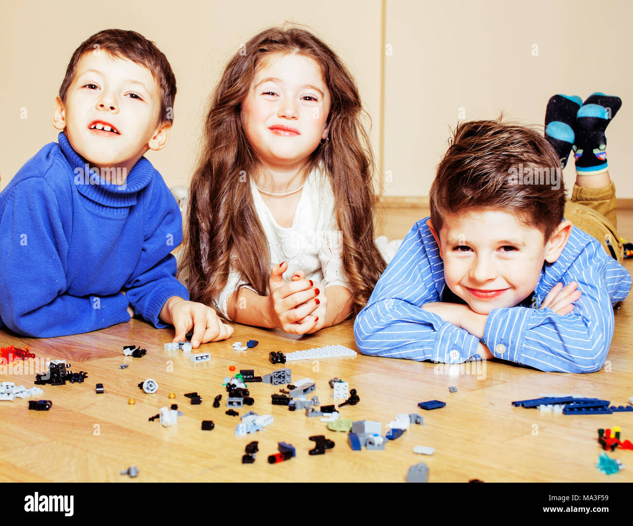 funny cute children playing toys at home, boys and girl smiling Stock ...