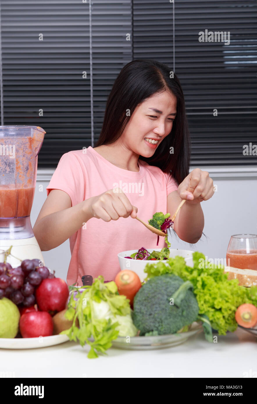 Sad woman eating salad hi-res stock photography and images - Alamy