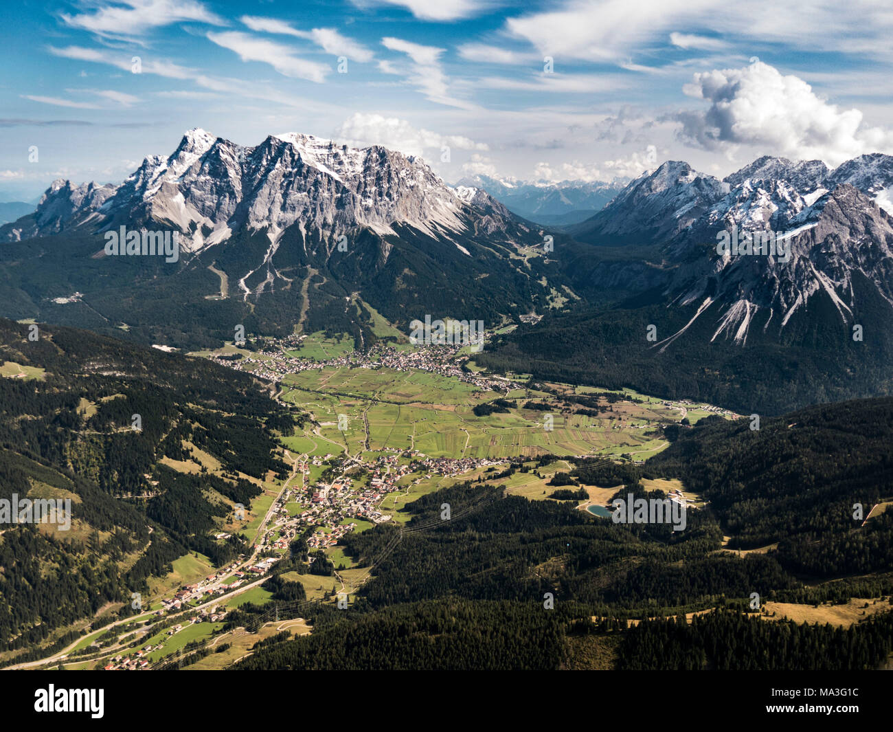 Aerial photo of the Zugspitze (mountain) and the villages of Lermoos ...