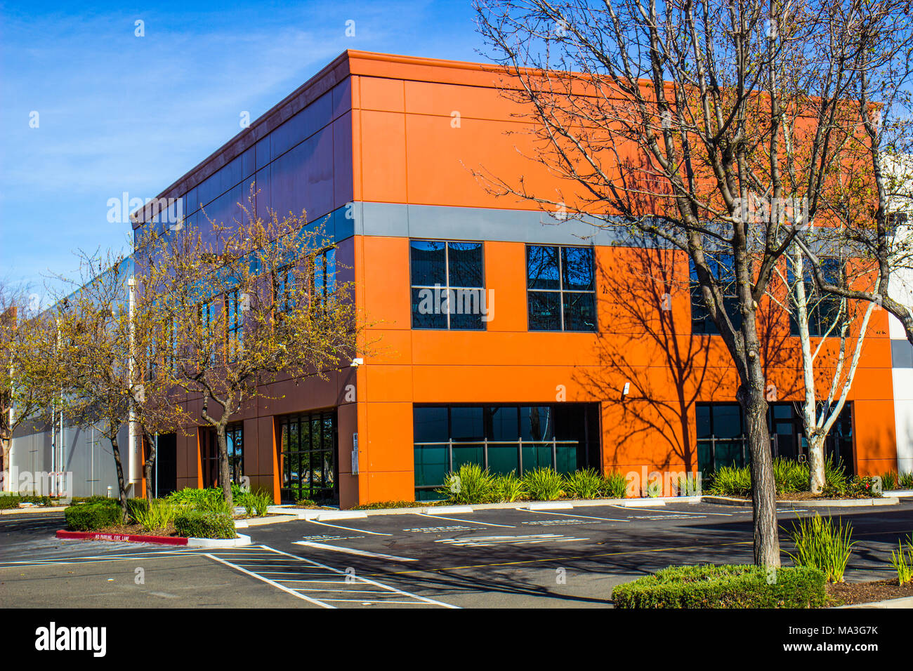 Bright Orange Corner Office Building Stock Photo - Alamy