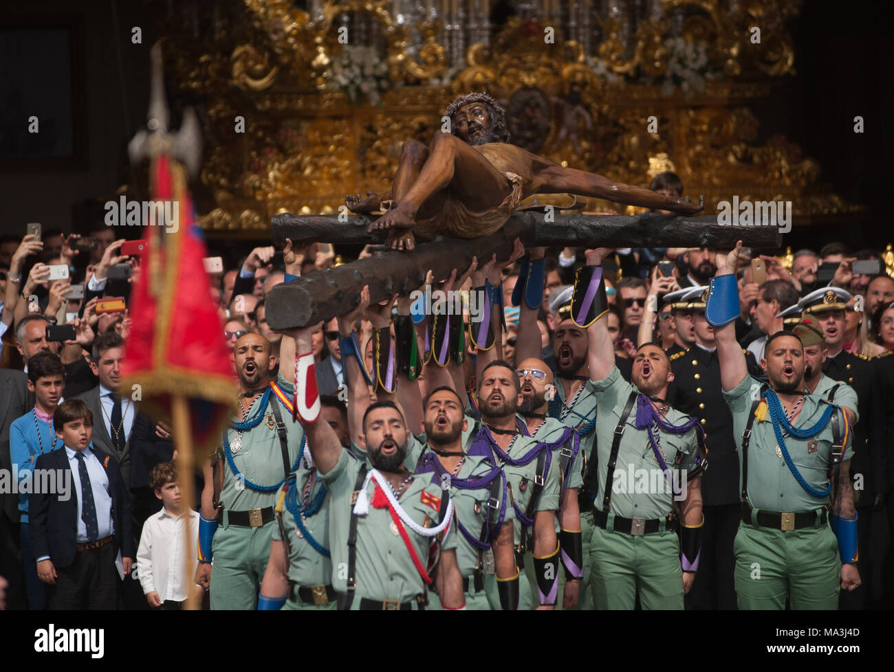 Malaga, Spain. 29th Mar, 2018. Spanish legionnaires carrying a figure ...