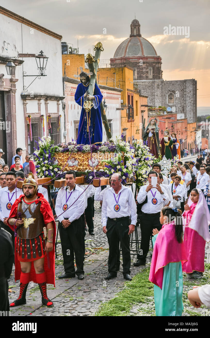 San Miguel de Allende, Mexico. March 28, 2018. Catholic devotees carry ...