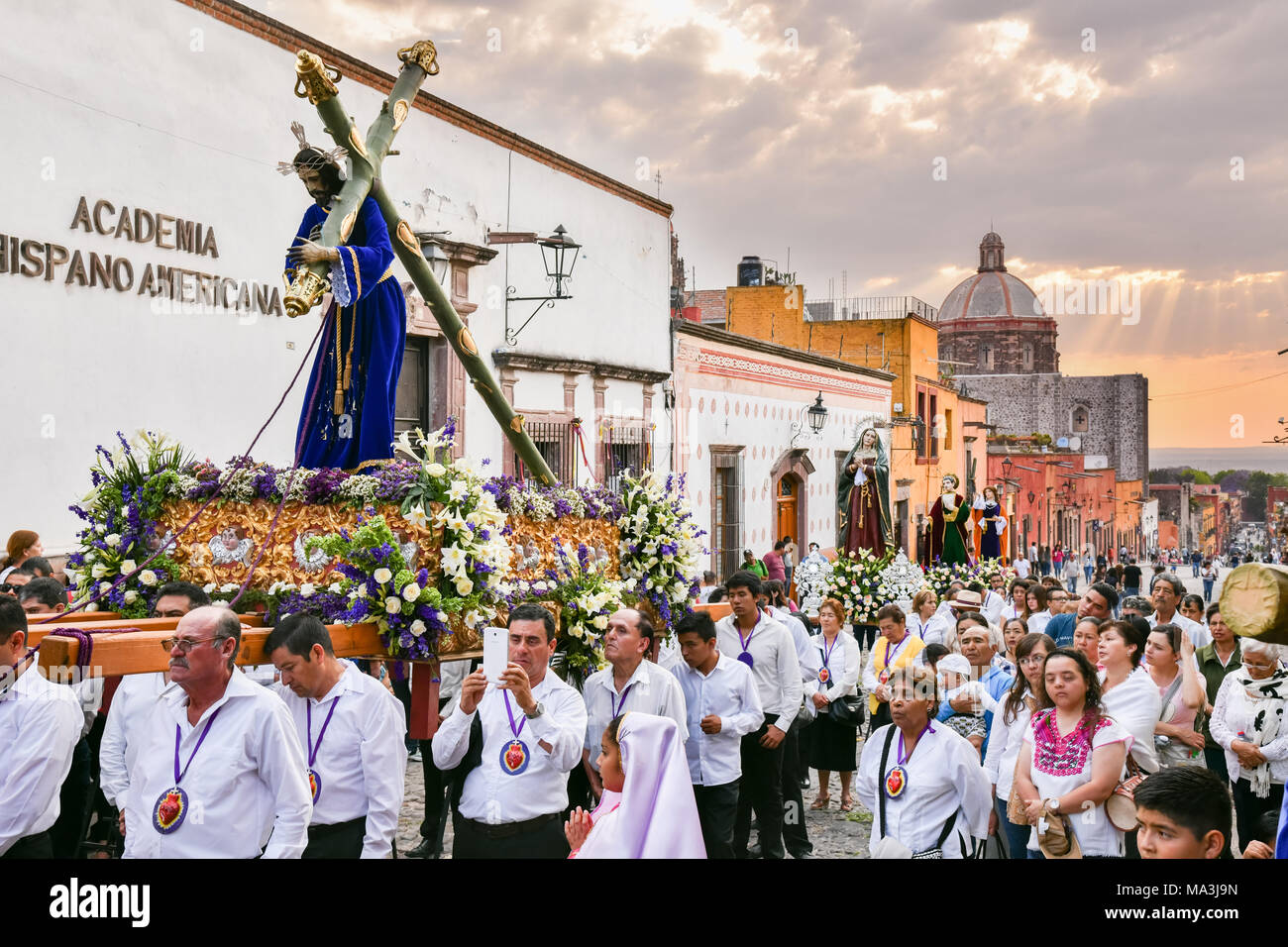 Catholic devotees carry a statue of Jesus during the Las Cruzes del ...