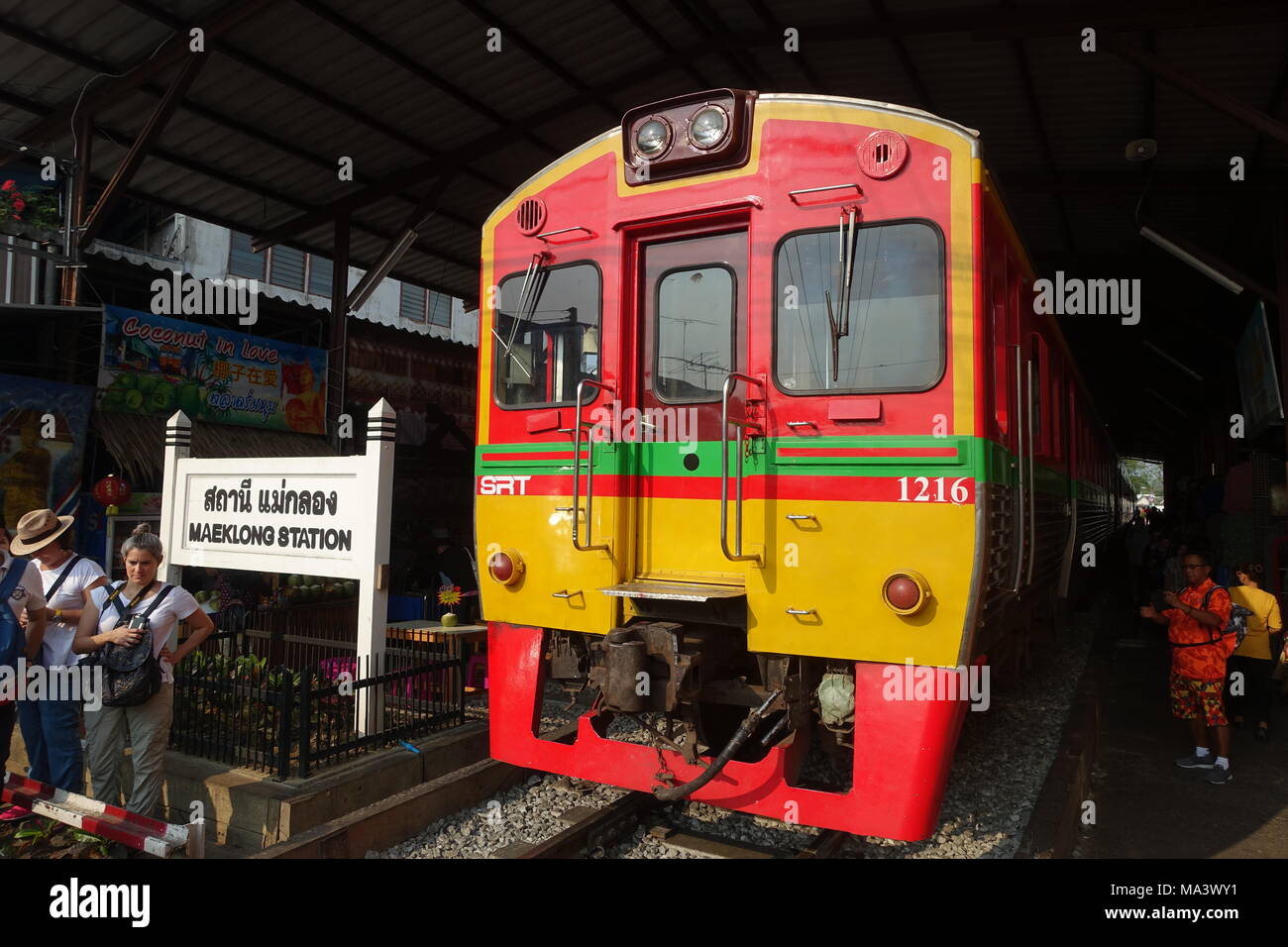 26 February 2018, Thailand, Samut Songkhram: A train stands at a small ...