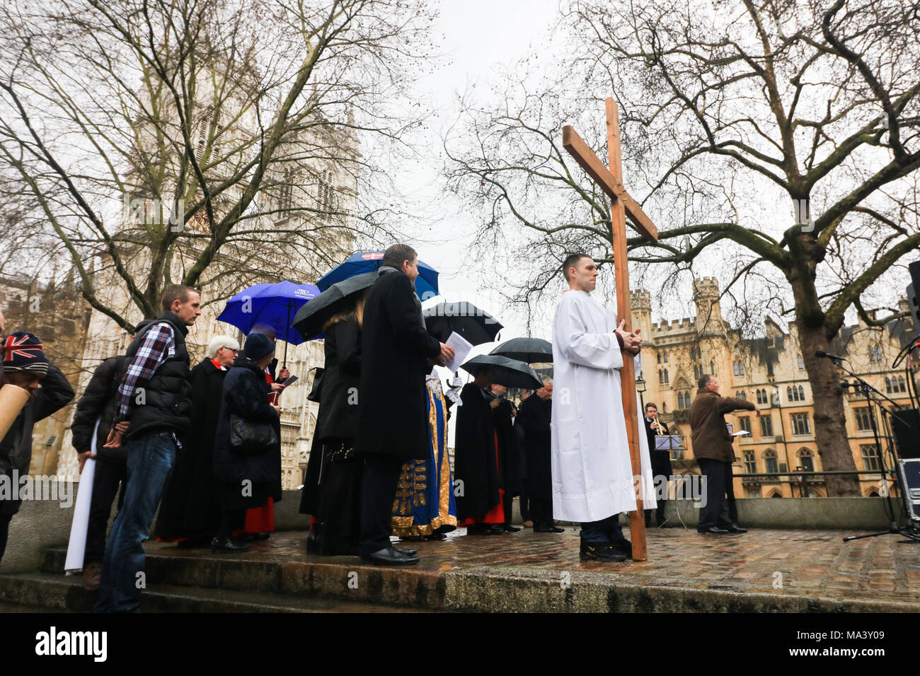 London, UK. 30th March 2018. Christian worshippers accomanied by clergy ...