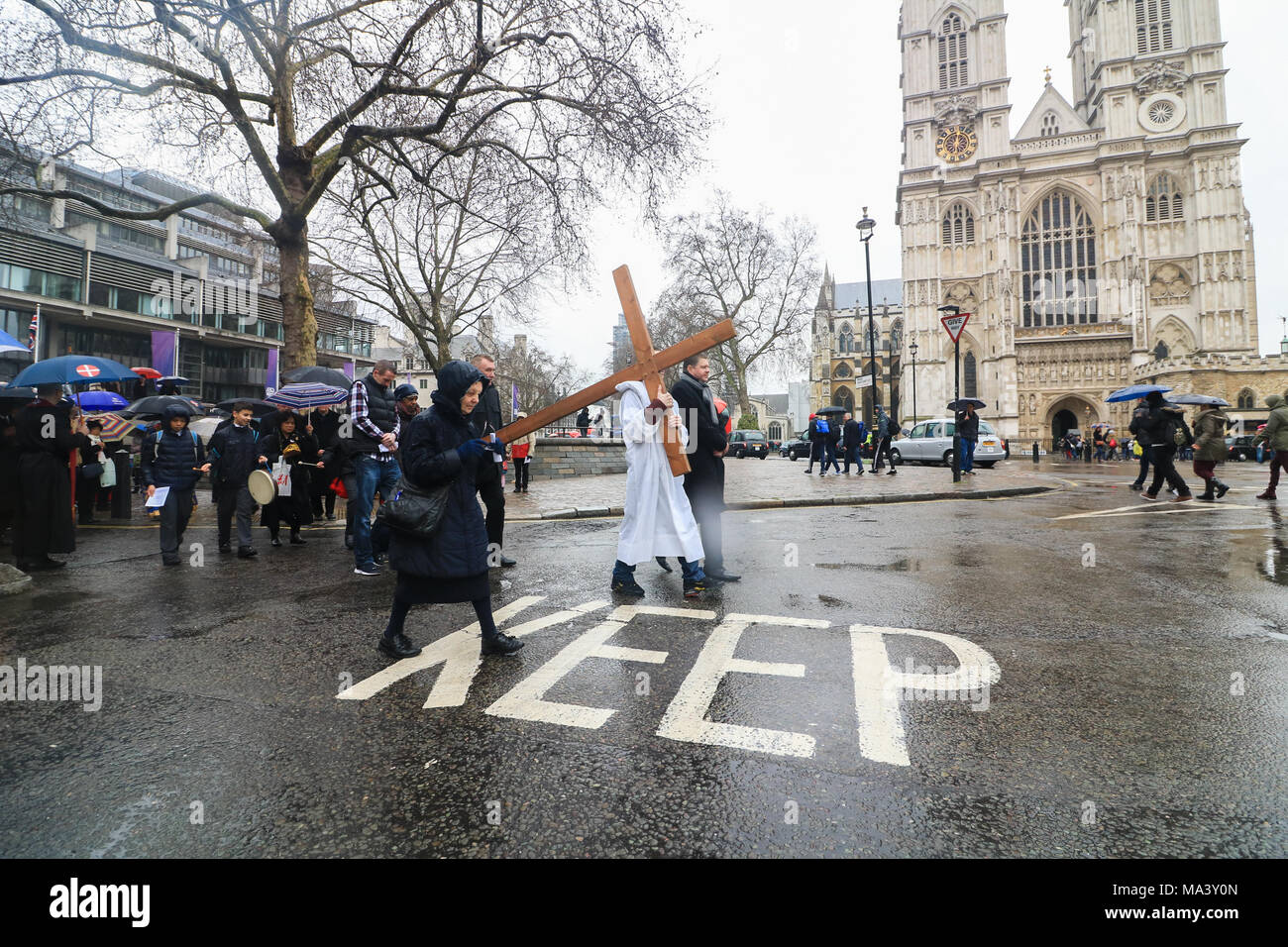 London, UK. 30th March 2018. Christian worshippers accomanied by clergy ...