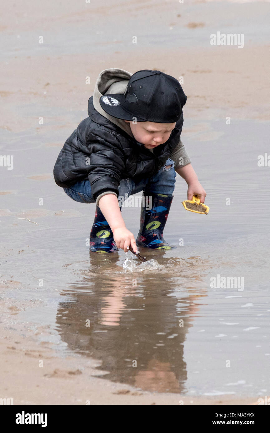 Child puddle adult hi-res stock photography and images - Alamy