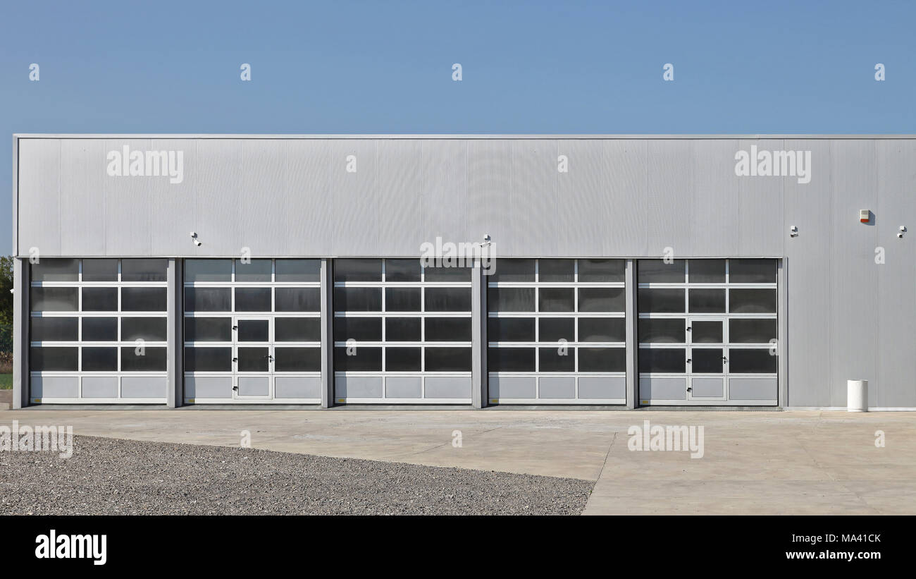 Five Big Doors at New Garage Service Building Stock Photo - Alamy