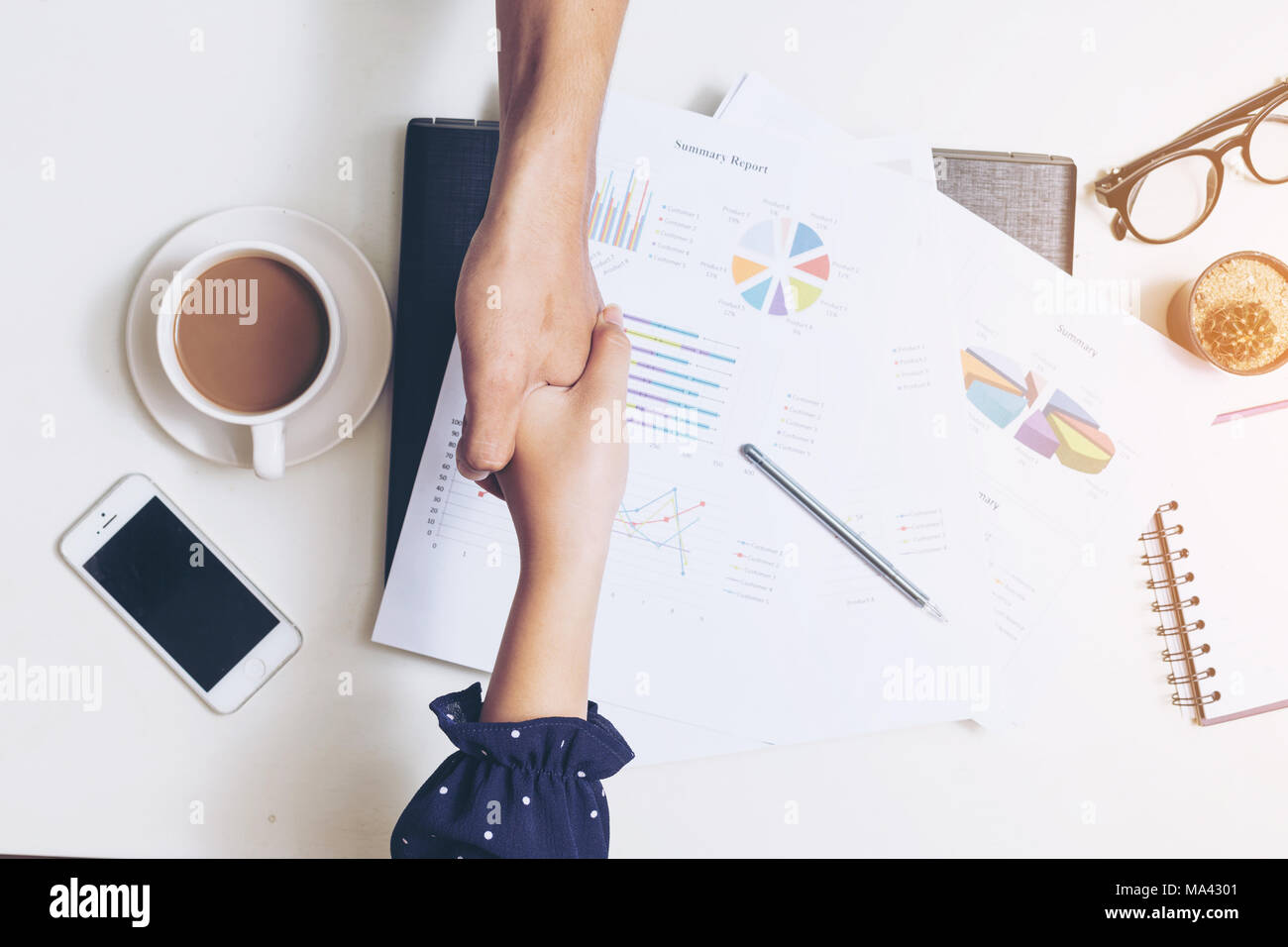 Business people handshake, sitting at the desk Stock Photo - Alamy