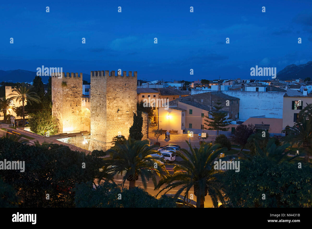 The historic town walls of Alcudia at dusk, Mallorca, Spain Stock Photo ...