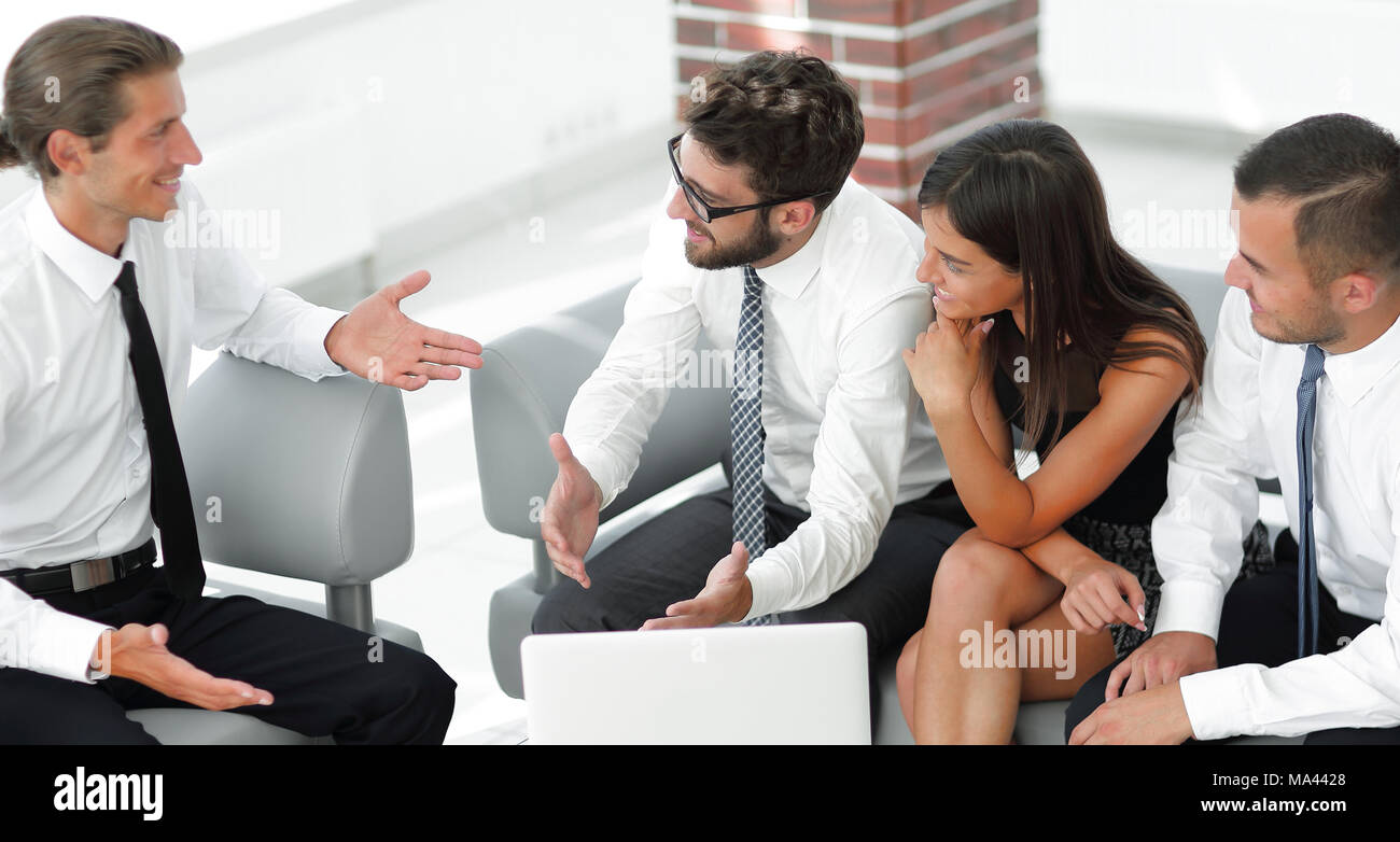 Manager and business team discussing business issues,sitting in the ...