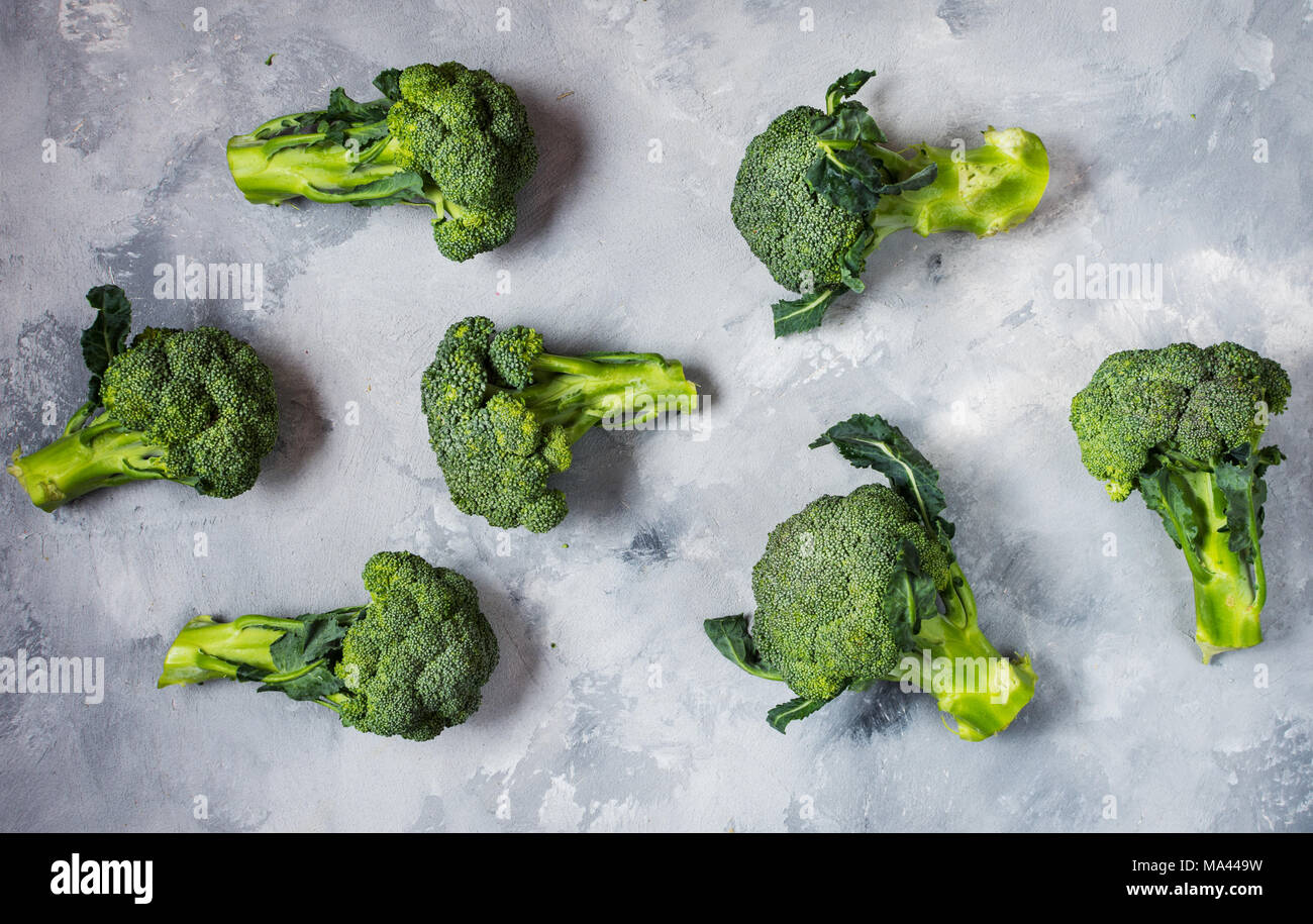 Raw broccoli on concrete background. Top view Stock Photo - Alamy