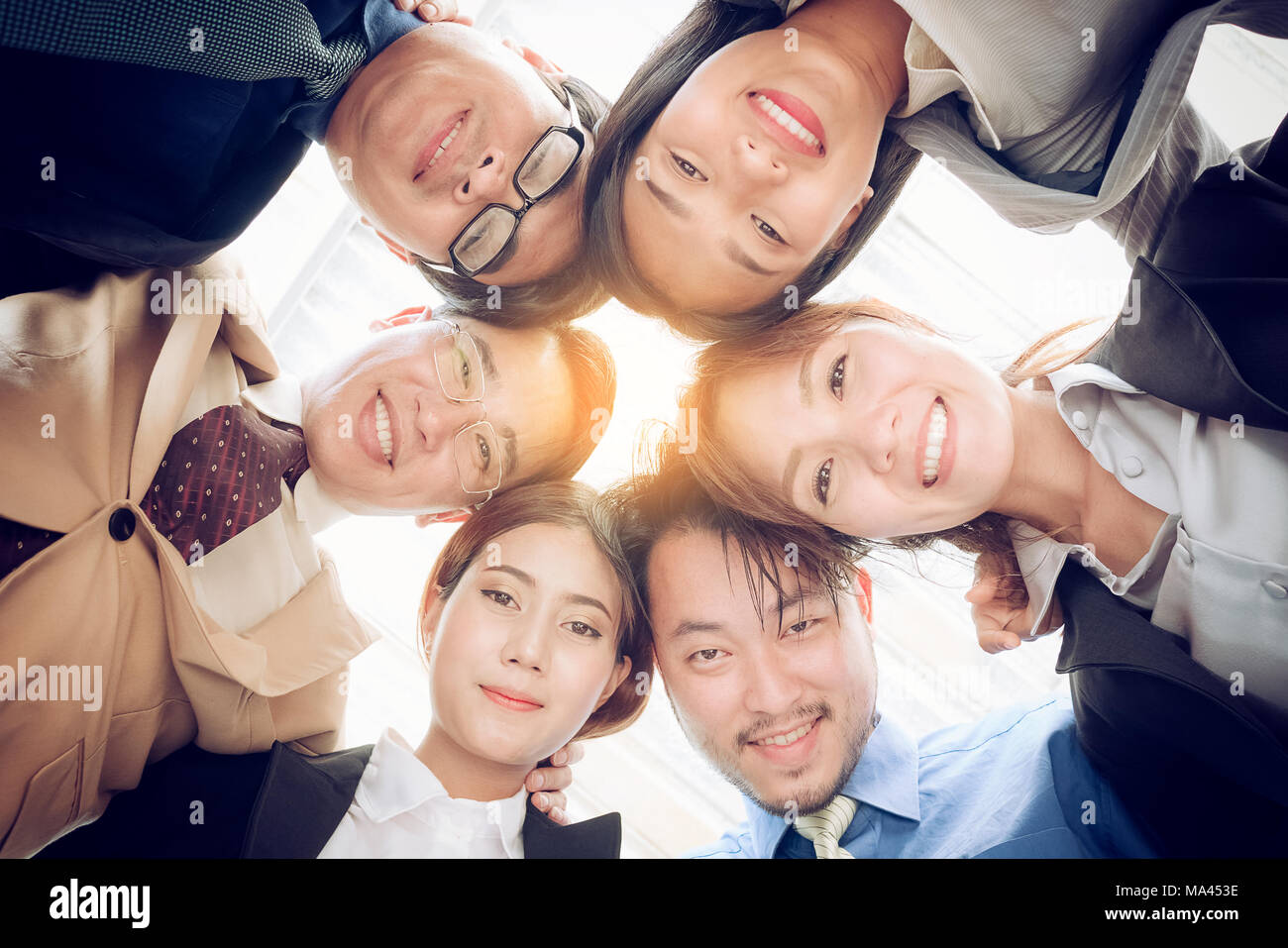 Putting their heads together hi-res stock photography and images - Alamy