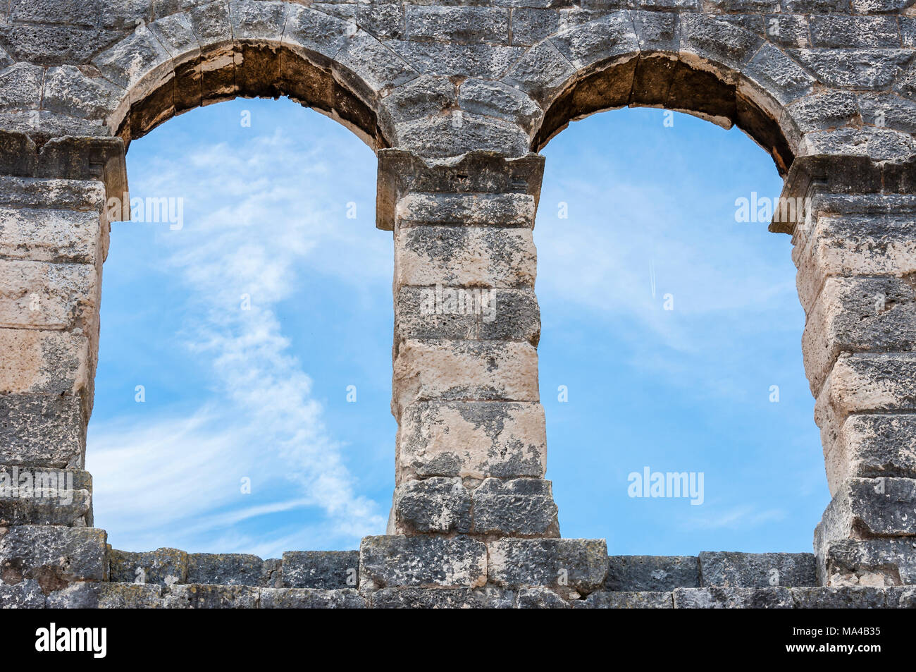 Sky view through the ancient Roman arch windows apertures Stock Photo ...